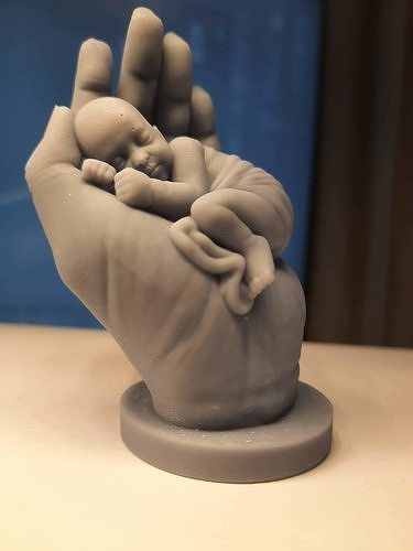 the baby is sleeping in the hand 3D model 3D printable | CGTrader
